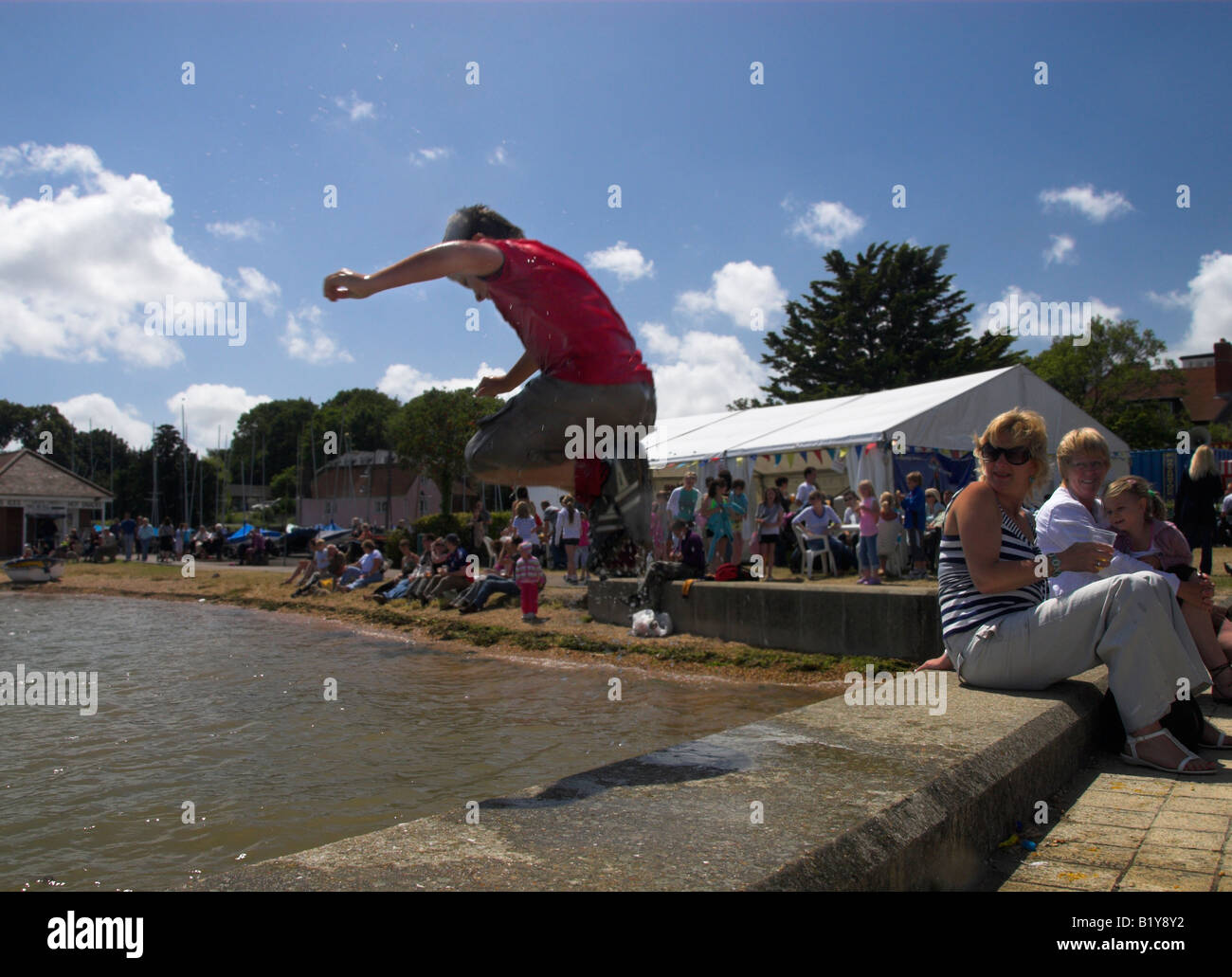 Child Jumping into the River Hamble Hampshire England UK Stock Photo ...