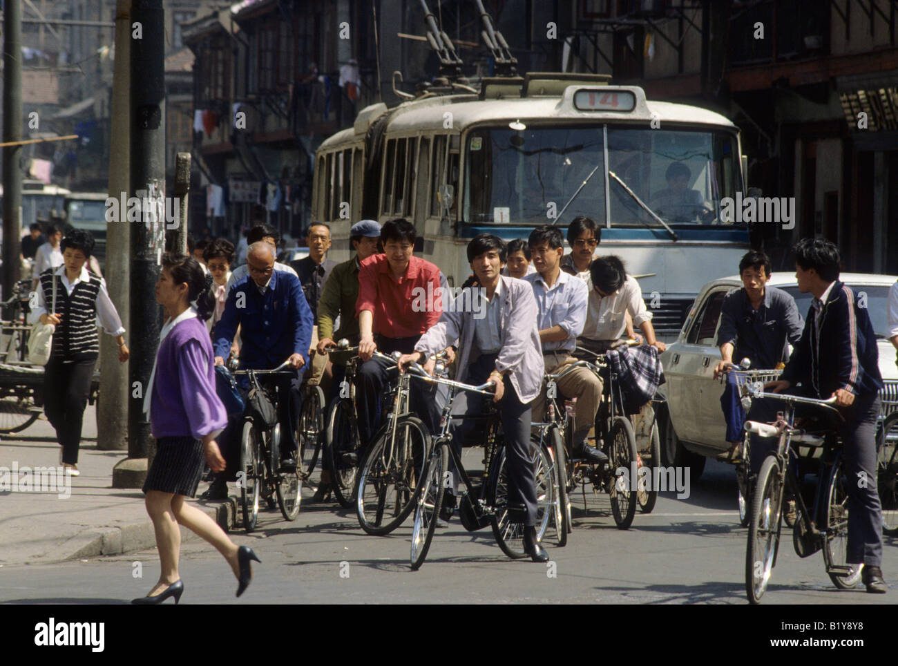 Chinese wait at a traffic intersection in Shanghai China Stock Photo ...