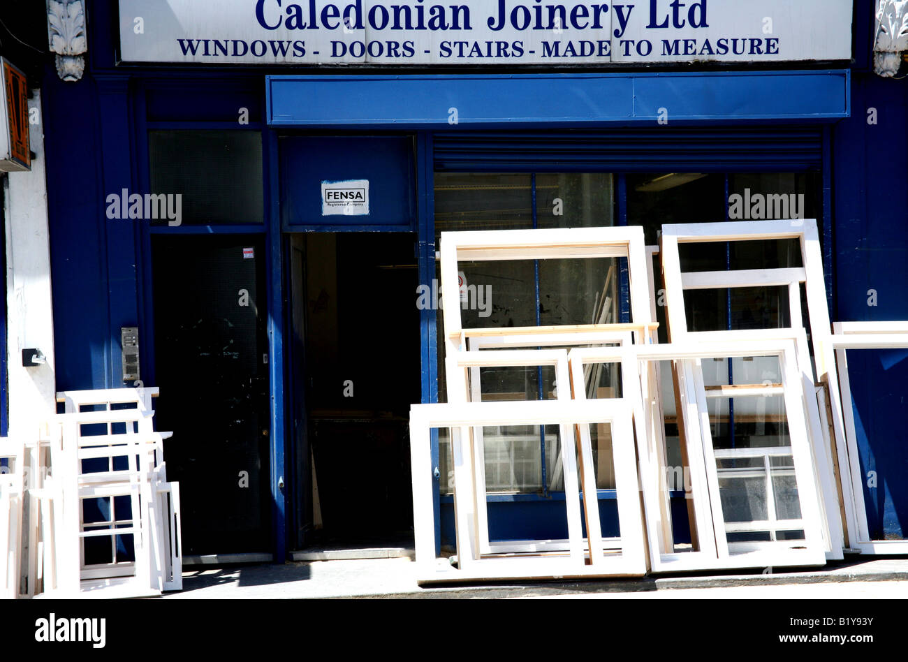 Window frames outside joinery shop in London Stock Photo - Alamy