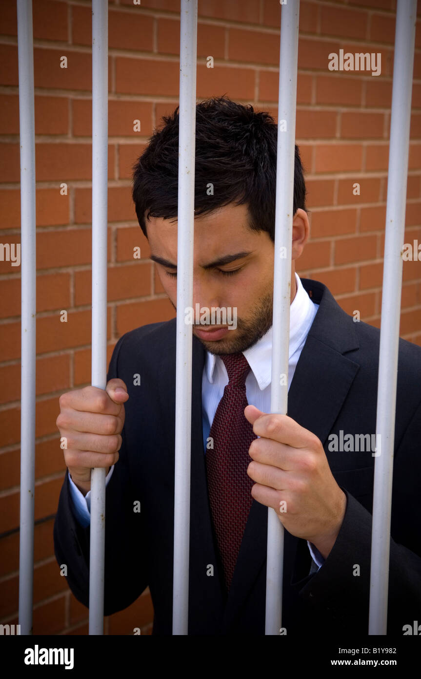 Businessman in jail Stock Photo - Alamy