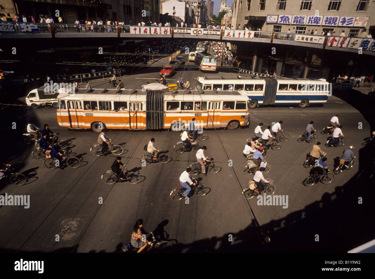 Chinese move through a traffic intersection in Shanghai China Stock ...