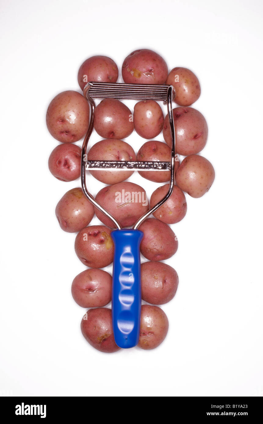 A blue handled potato masher with red potatoes Stock Photo - Alamy
