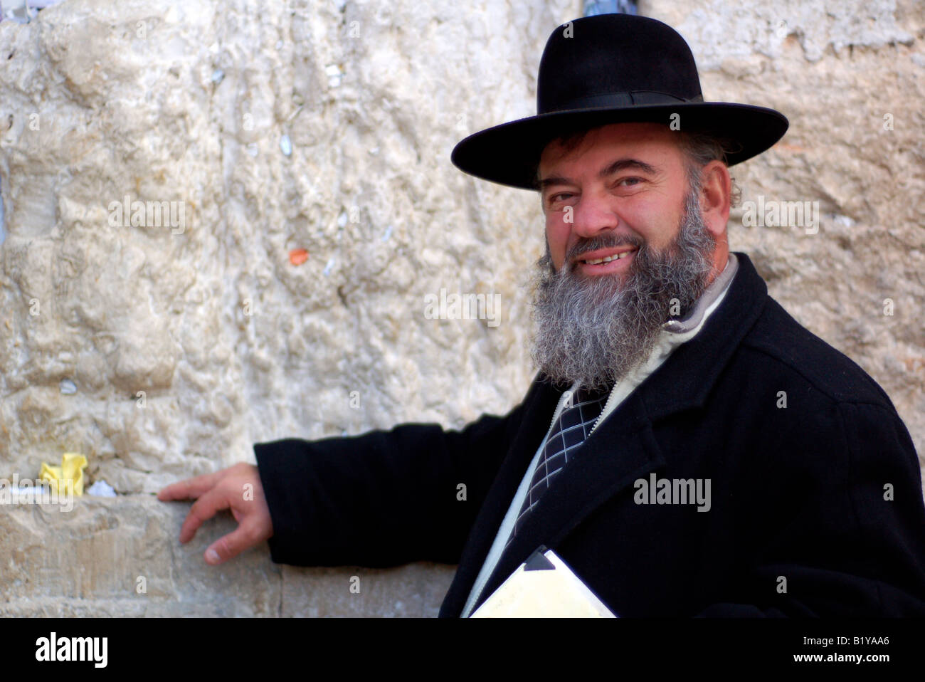 An Orthodox Jewish man stands by the Western Wall in Jerusalem, Judaism ...