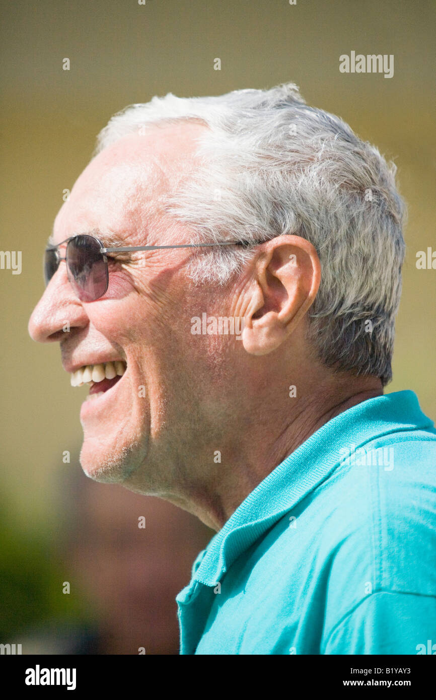 Side profile of a senior man smiling Stock Photo - Alamy