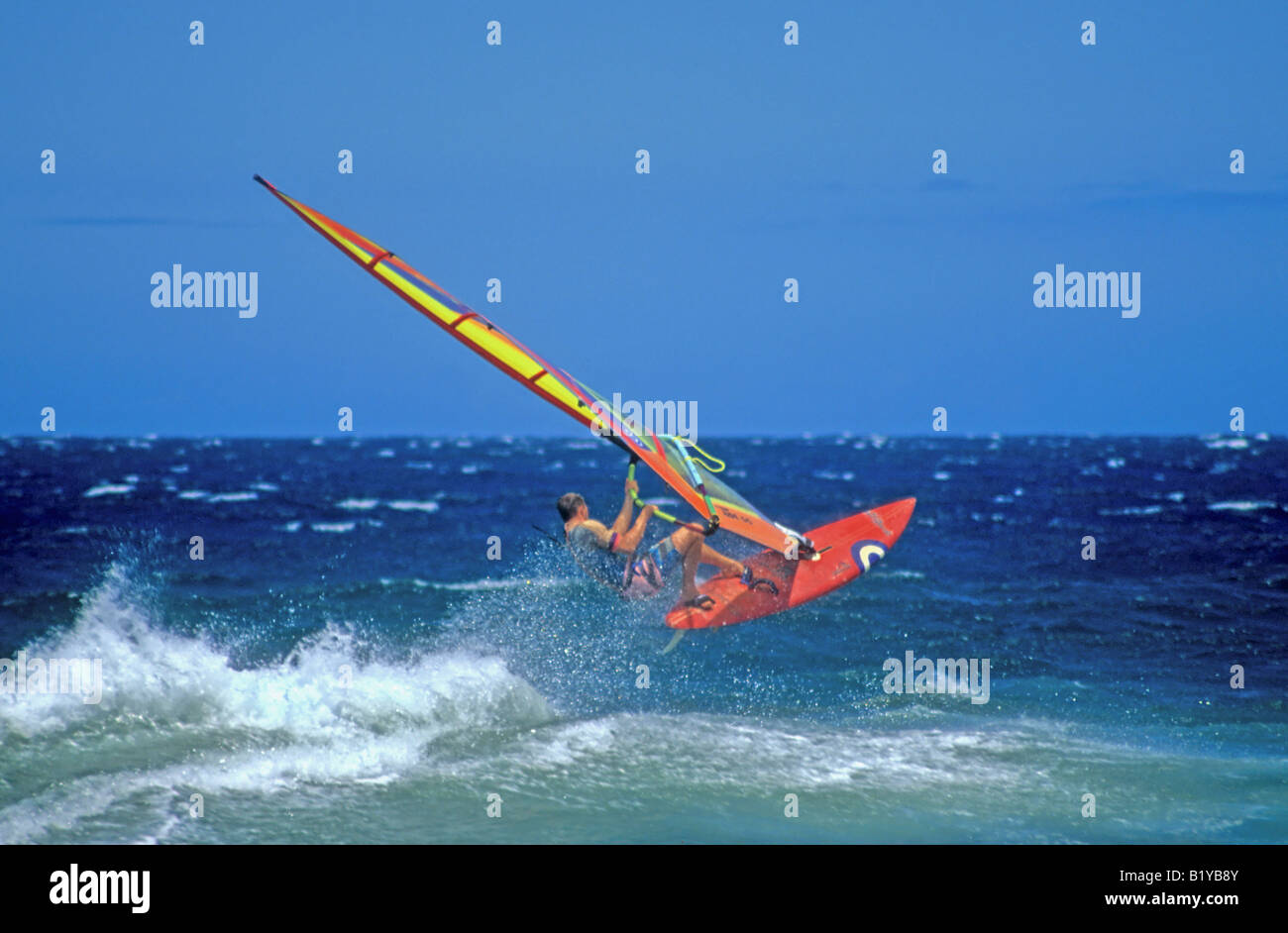 Windsurfers jumping waves hi-res stock photography and images - Alamy