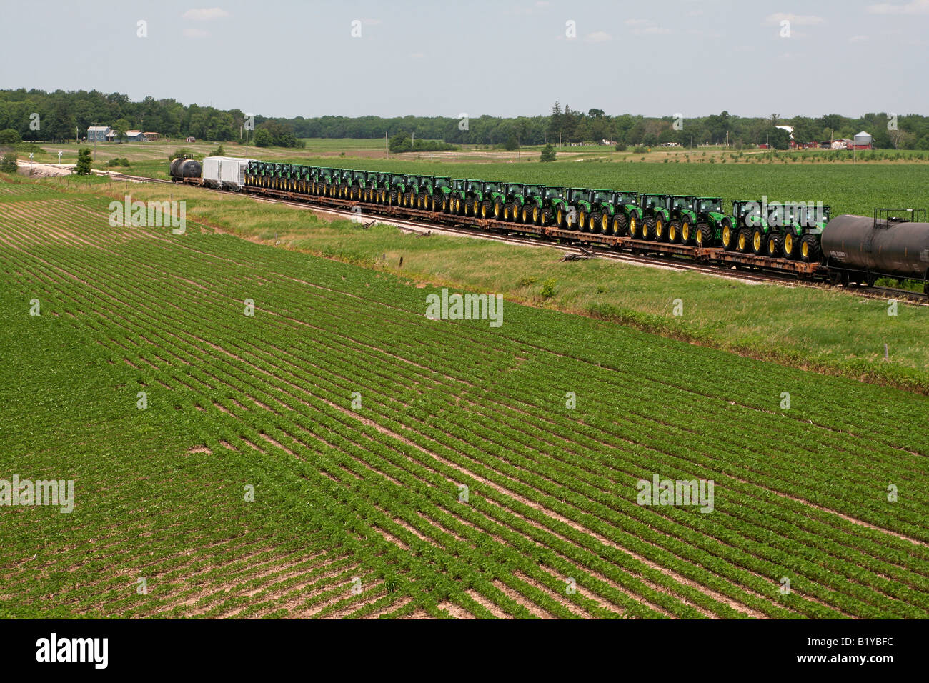 Farm tractors on way to farmers via rail from Waterloo Iowa factory ...
