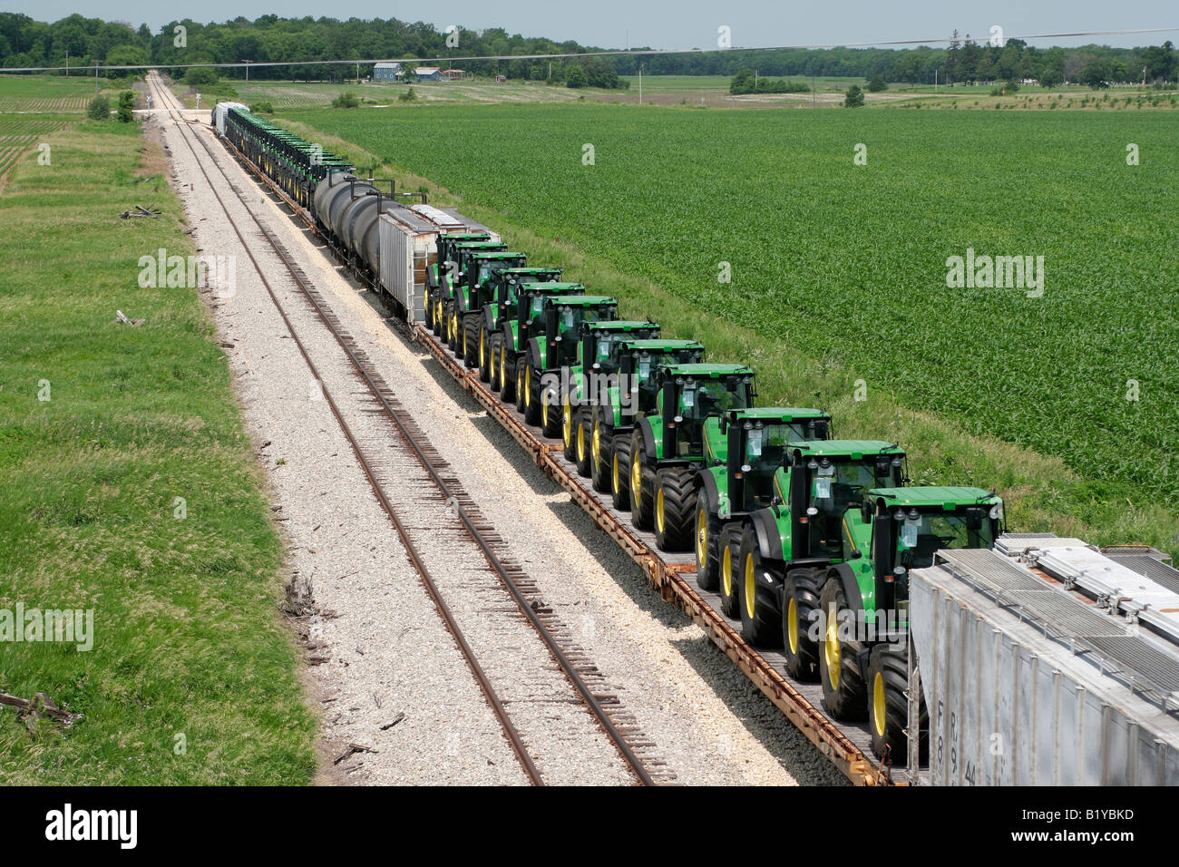 Train filled with green machines John Deere tractors from nearby ...