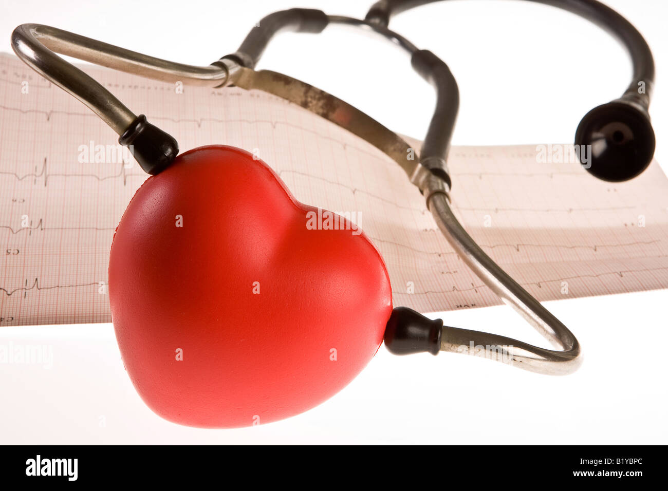 Stethoscope and heart lying on a cardiogram Stock Photo - Alamy