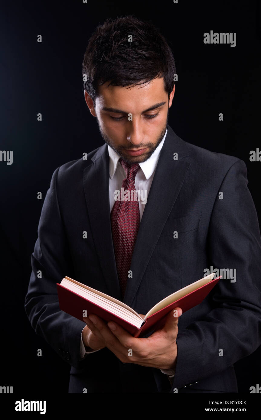 Business man reading agenda Stock Photo - Alamy