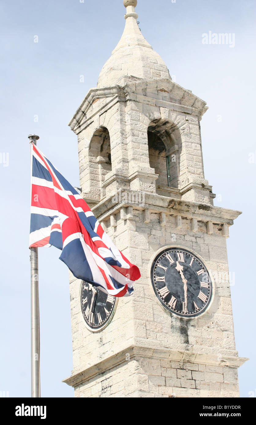 A stone and concrete clock tower with British flag Stock Photo - Alamy