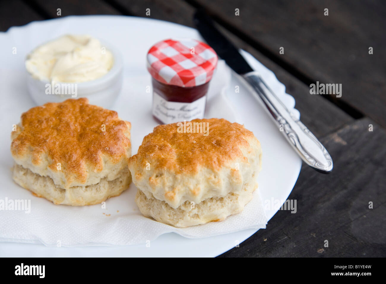 A traditional English Cream Tea comprising tea scones jam and cream ...