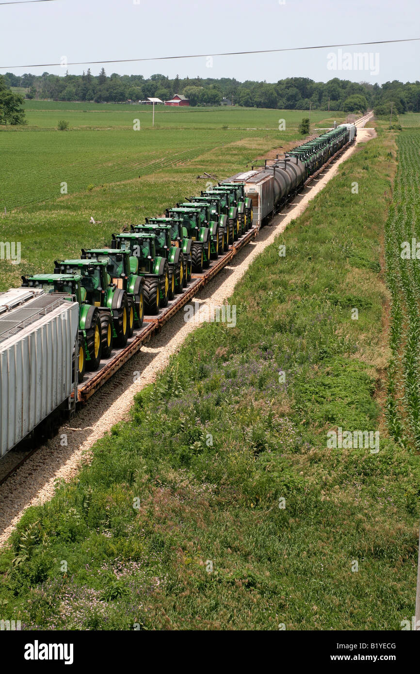 Farm tractors on train waiting shipment near Waterloo Iowa factory ...
