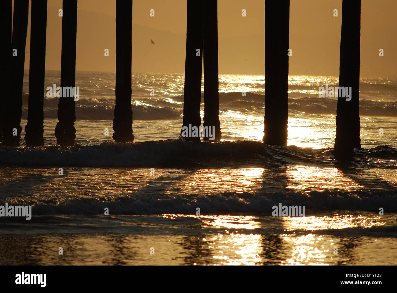Sunset at Beach Pier Stock Photo - Alamy