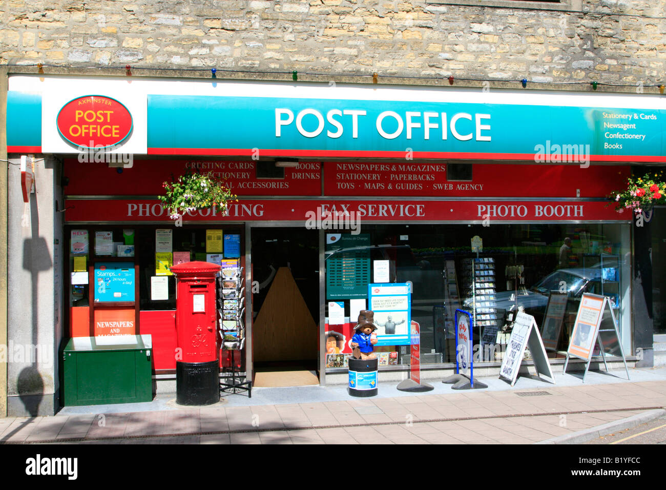 post office axminster town centre high street shops devon england uk gb ...