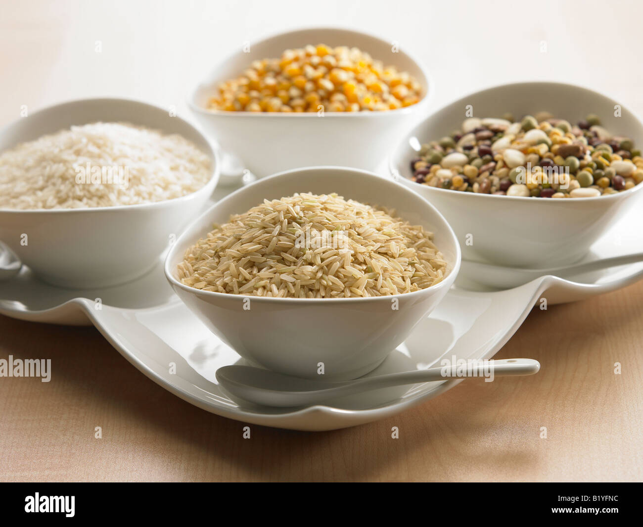 four bowls of dried stuff-mixed beans, rice, corn, brown rice Stock ...