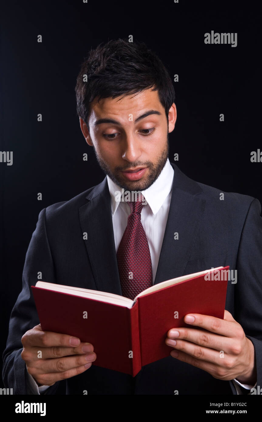 Man reading book shocked expression hi-res stock photography and images ...