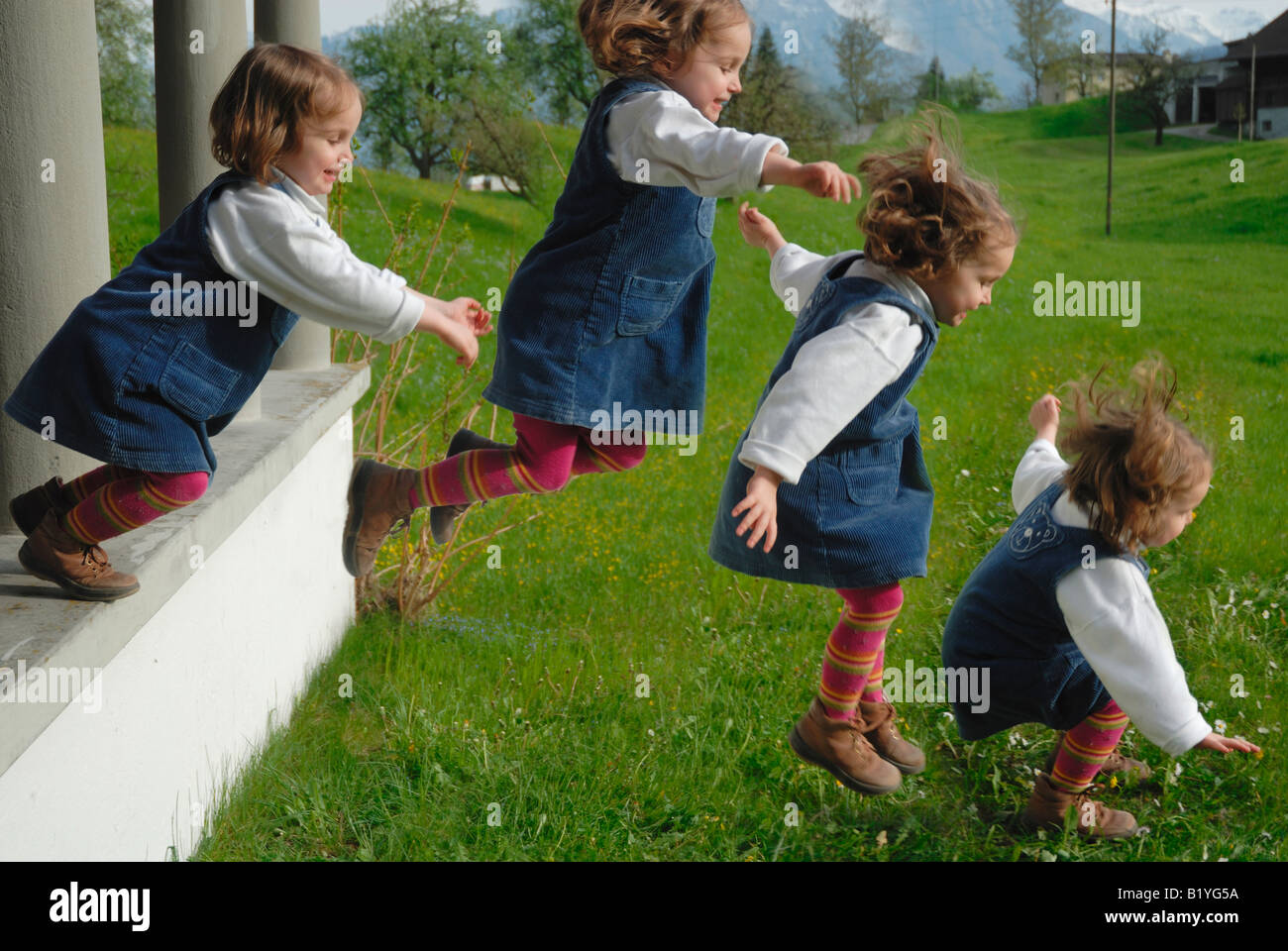 little kid jumping from a little wall (series Stock Photo - Alamy