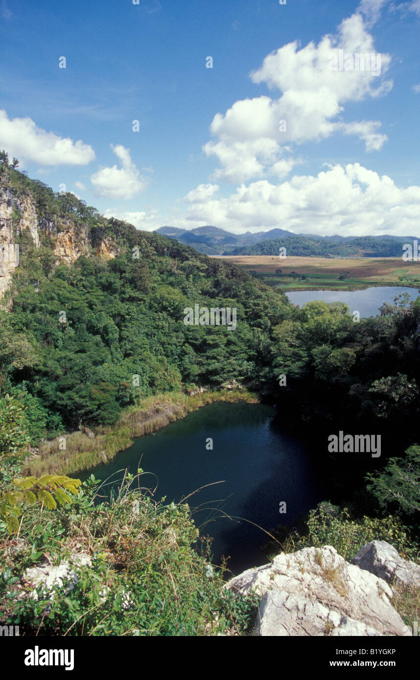 The Cenote Agua Azul (foreground) at at the Mayan ruins of Chinkultic ...