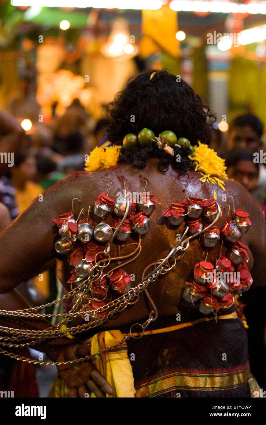 DEVOTEE WITH HOOK PIERCING IN BACK INSIDE THE BATU CAVES DURING THE ...