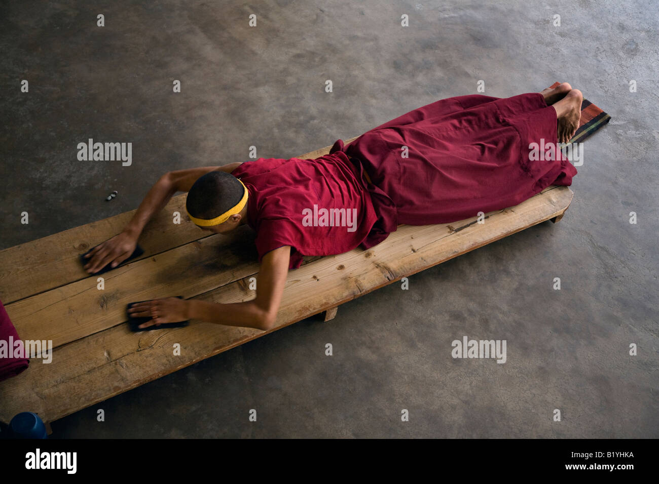 A TIBETAN MONK does prostrations at the NAMGYAL GOMPA or MONASTERY ...