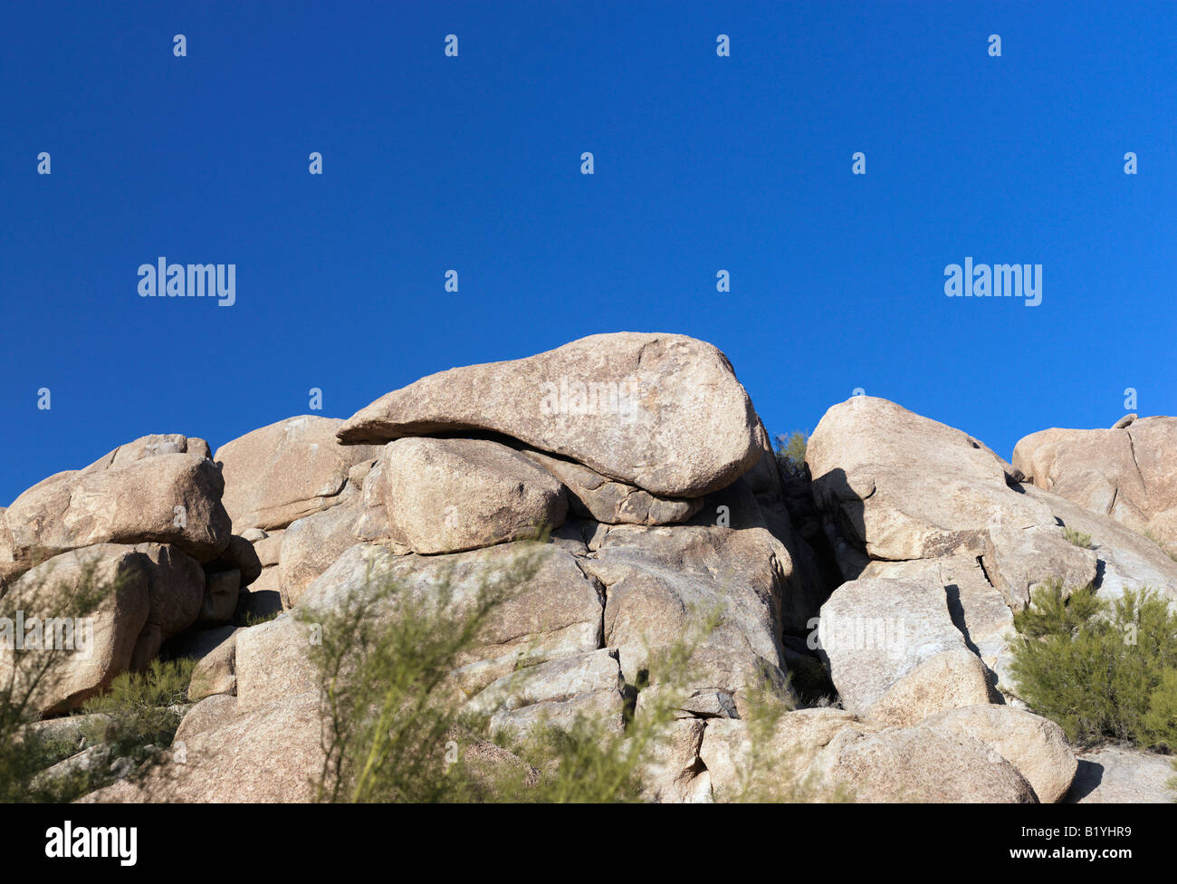 Boulders in the Arizona desert north of Scottsdale against a brilliant ...