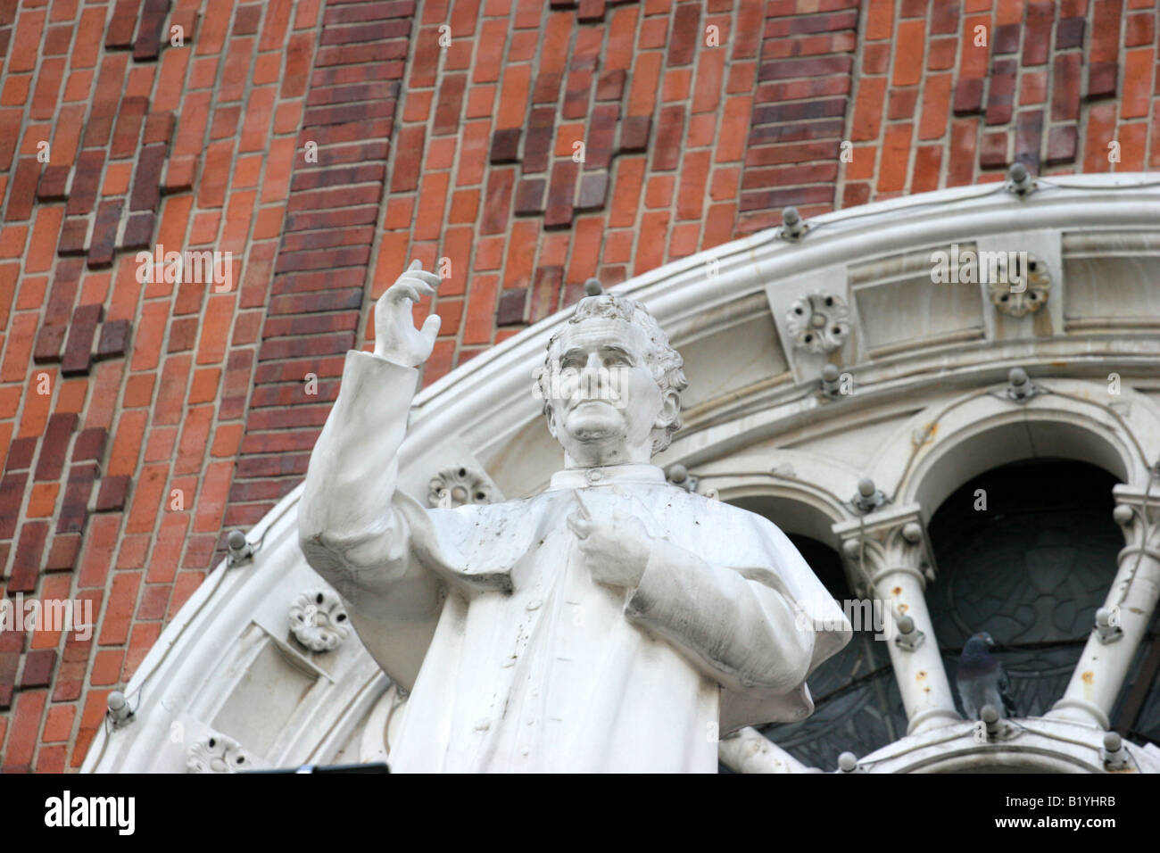 San Juan Bosco or Don Bosco statue at the entrance of his basilic in ...