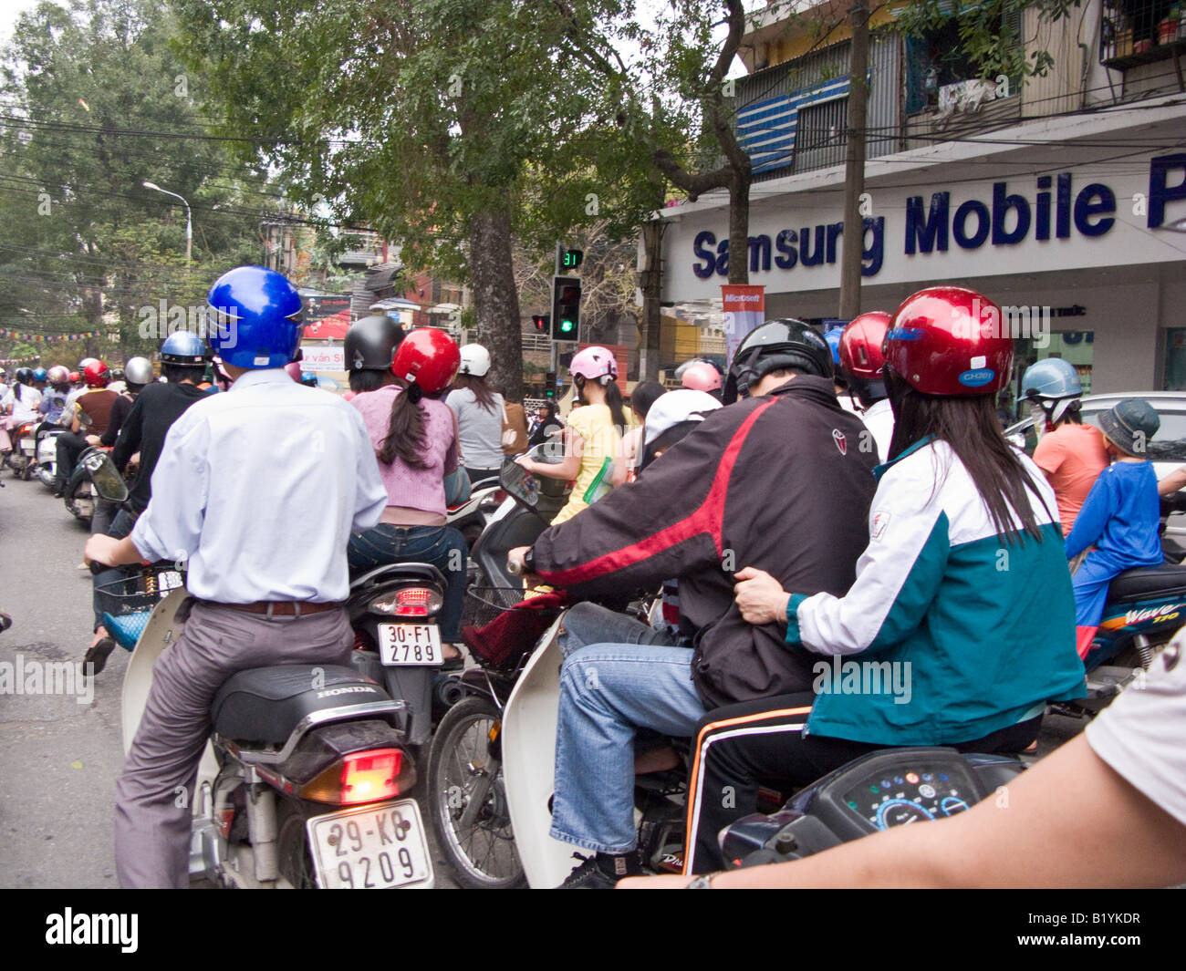 motorbike traffic in busy street in Hanoi, Vietnam Stock Photo - Alamy
