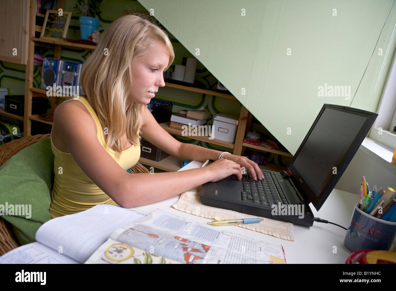 Teenage girl behind computer Stock Photo - Alamy