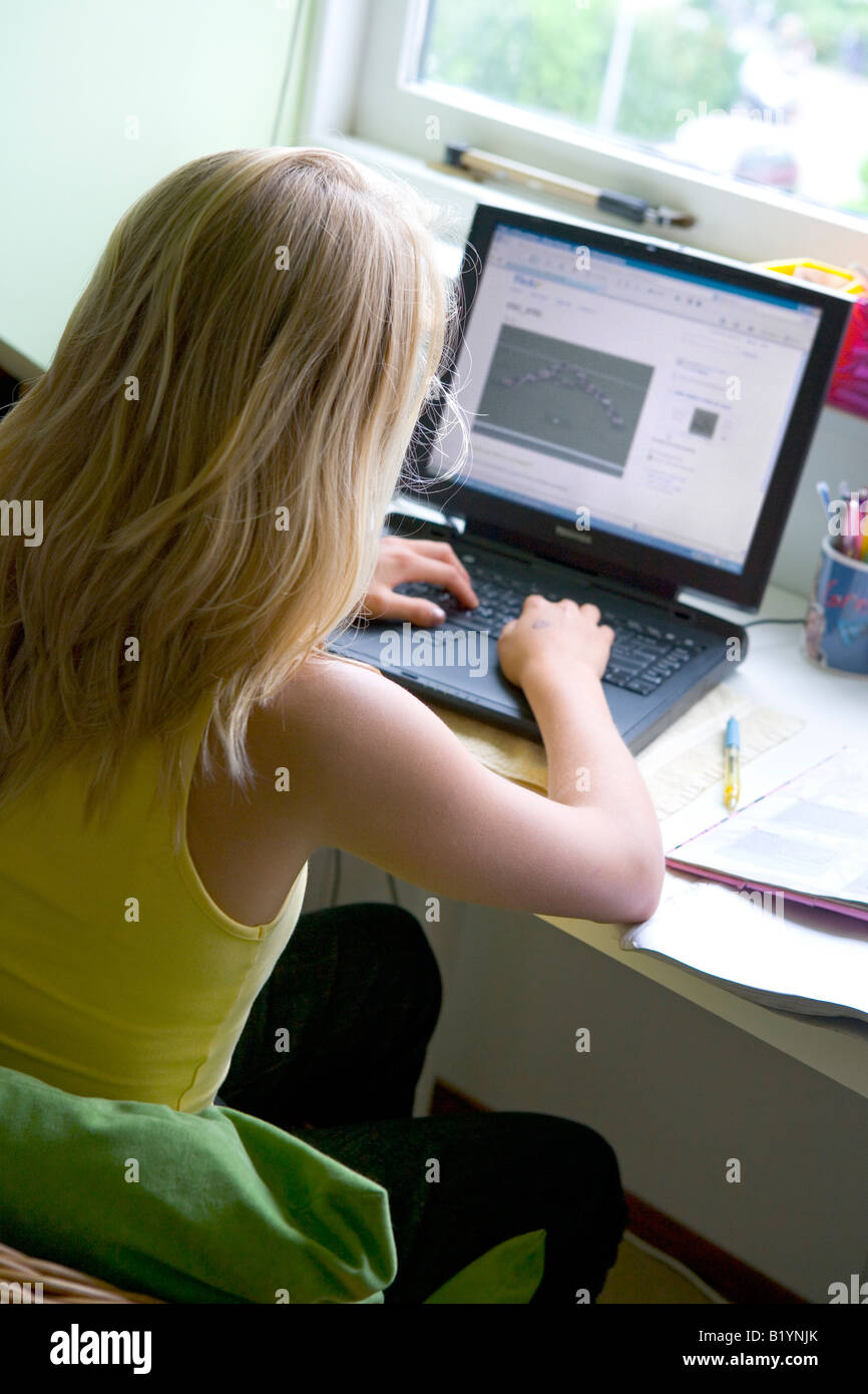 Teenage girl behind computer Stock Photo - Alamy