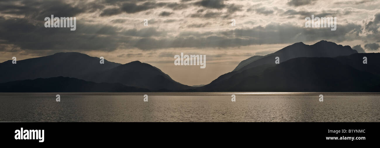 Evening light shines on the mountains along the western edge of Loch ...