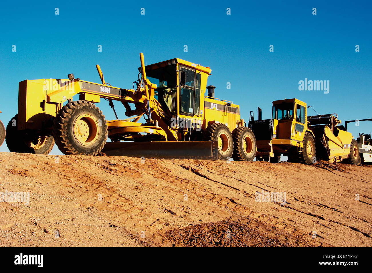 Heavy construction equipment parked on a residential construction site ...