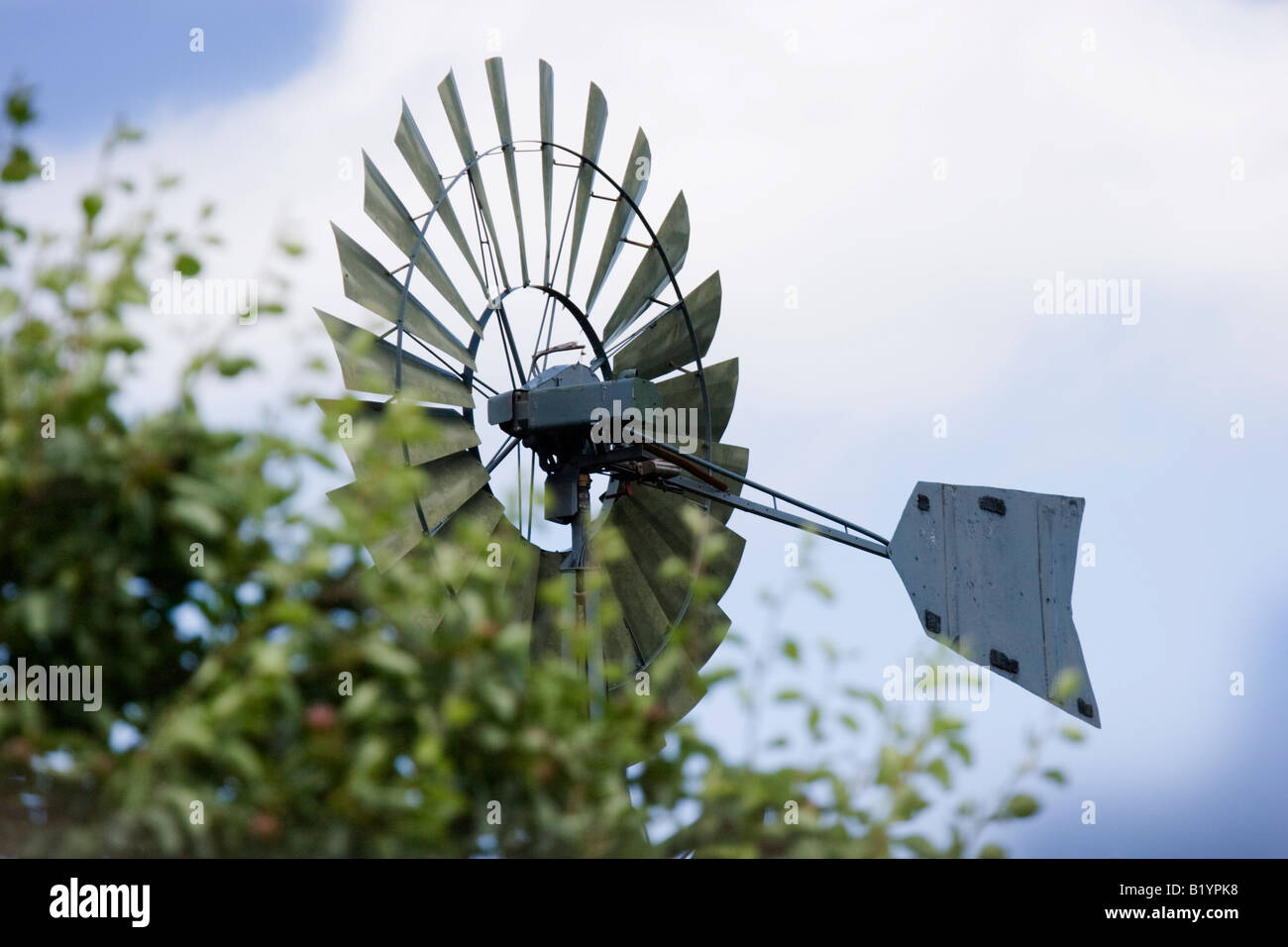 Windmill generating electrical energy for the home Stock Photo - Alamy