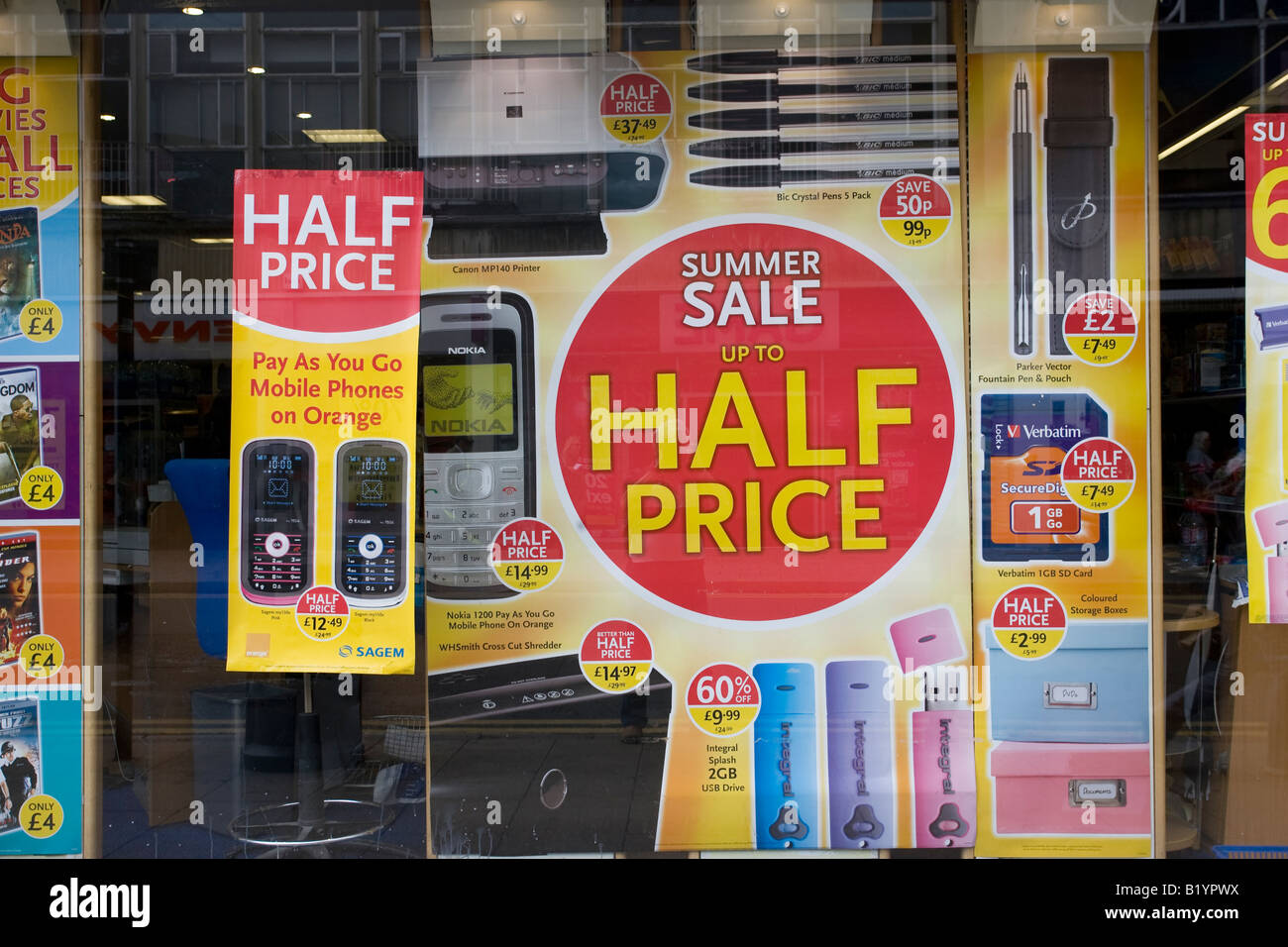 Large half price sale signs in shop window Cheltenham High Street UK ...
