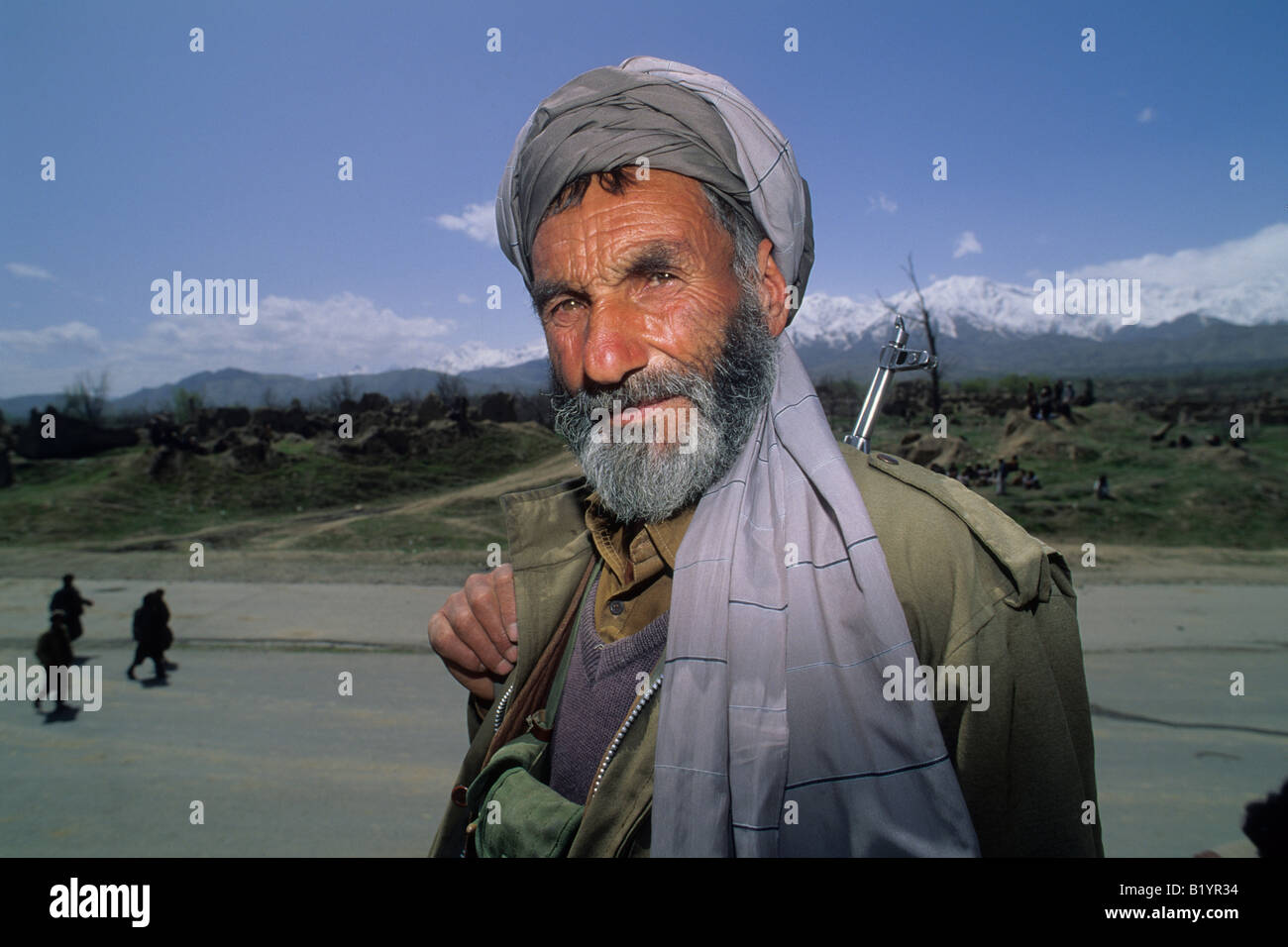 An Afghan male with rifle stands in Kabul Afghanistan Stock Photo - Alamy