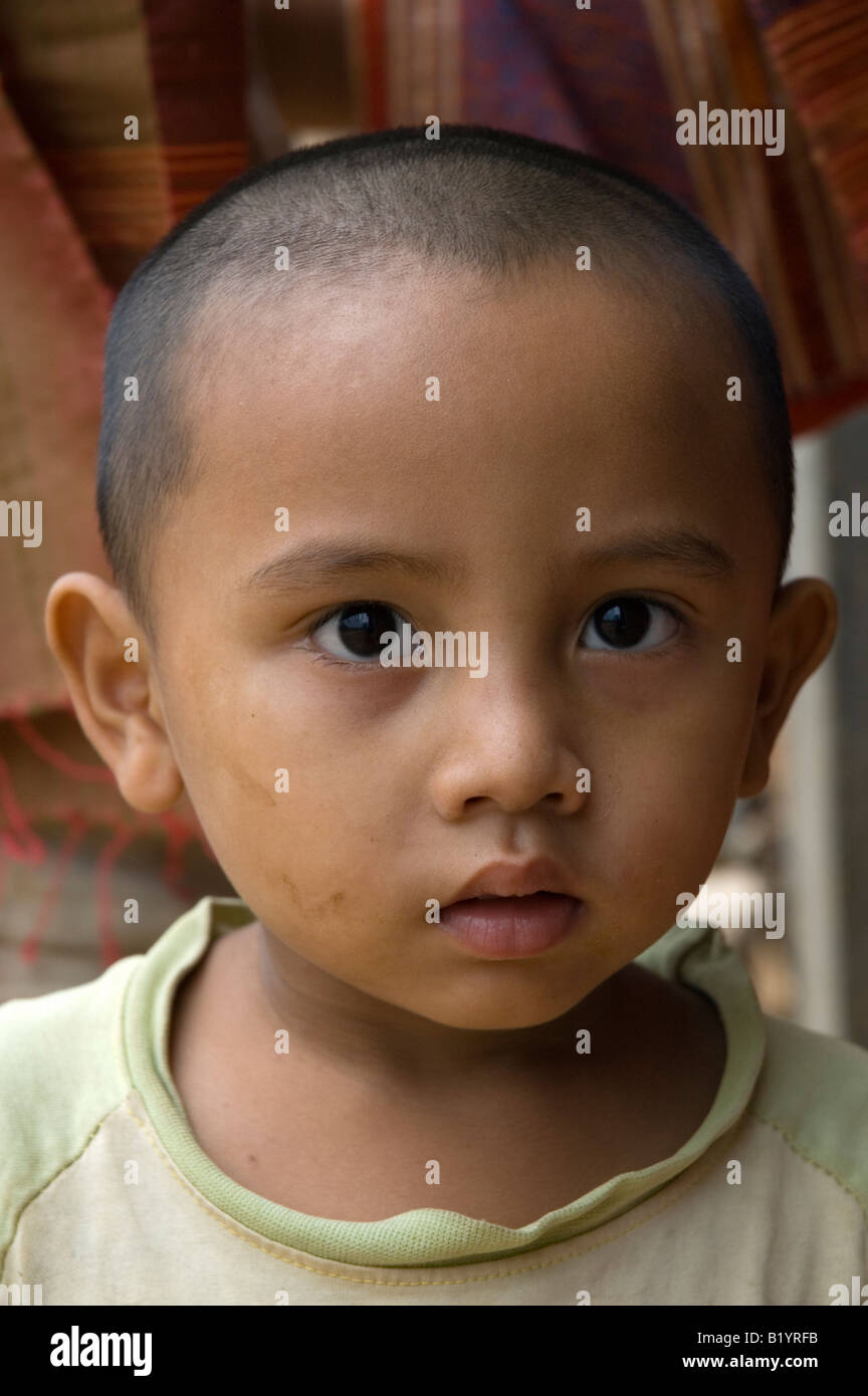 Young boy in a village outside of Vang Vieng, Laos Stock Photo - Alamy