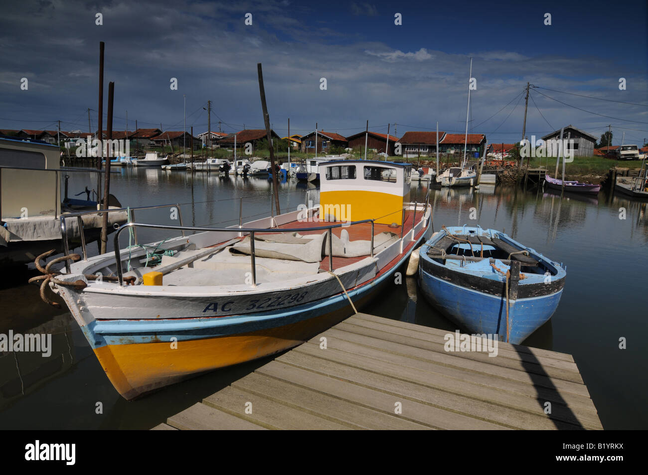 Fishing boats in a small harbour Stock Photo - Alamy