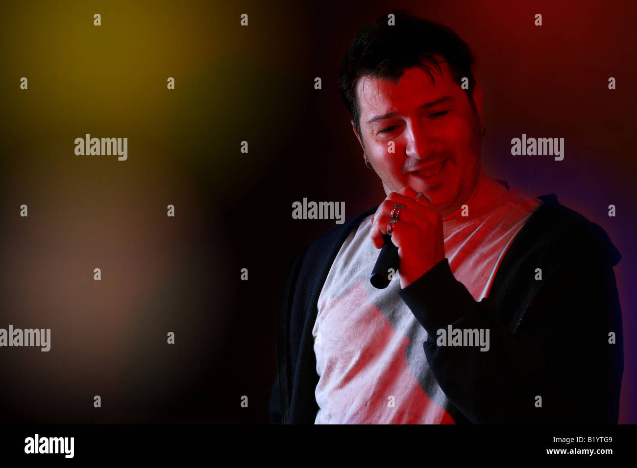 Rock singer on a scene singing rock in ecstasy Stock Photo - Alamy