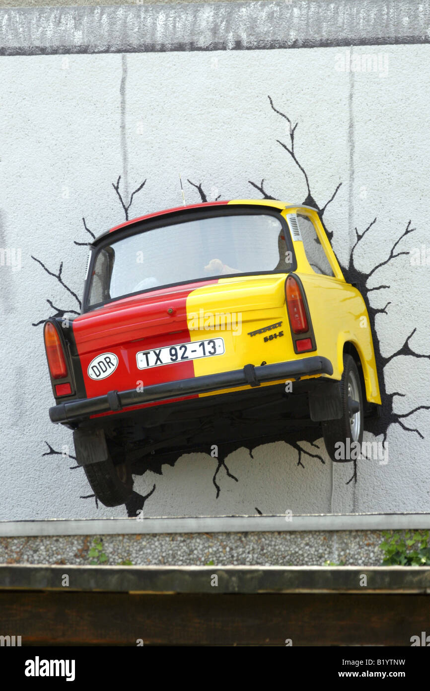 black red gold german Trabbi stucking in house wall Germany Stock Photo ...