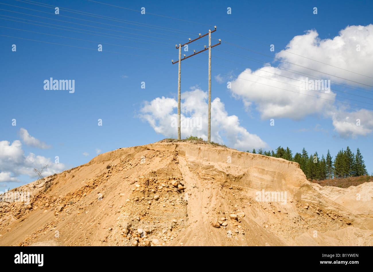 Wooden power line pylon at the top of eroding sandy ridge , Finland ...