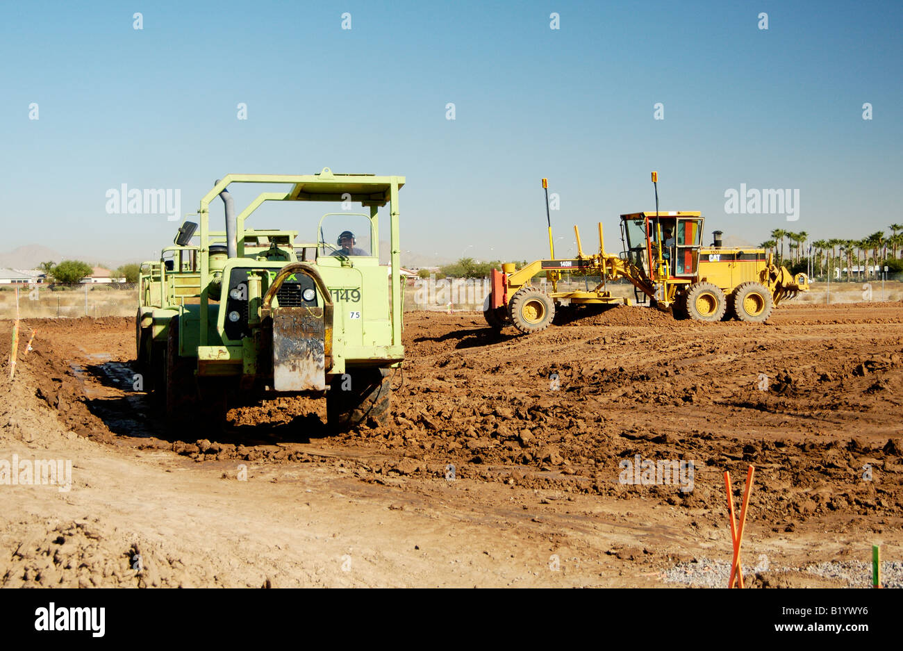 Heavy construction equipment parked on a residential construction site ...
