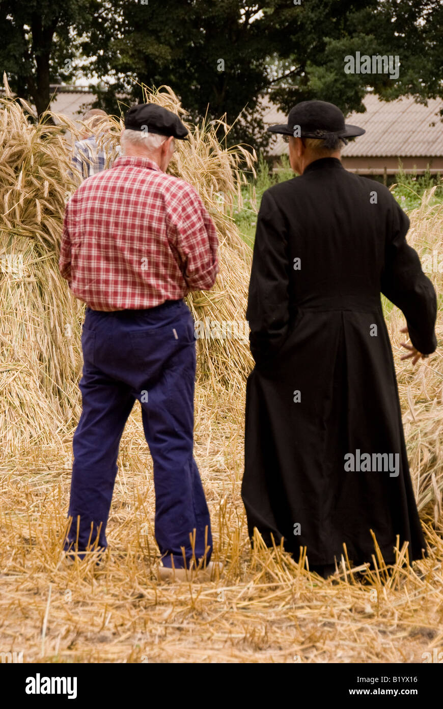 Priest and farmer waiting to bless the crop Stock Photo - Alamy