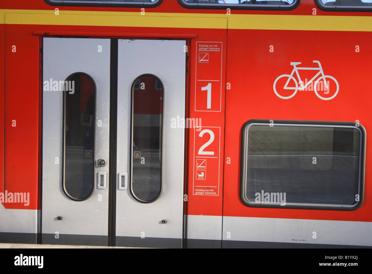 closed door of a red German train wagon, door and window. Photo by ...