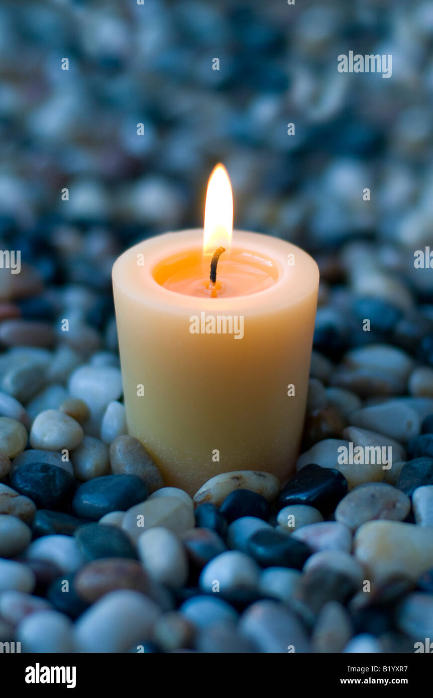 One candle stand in pebbles, USA Stock Photo - Alamy