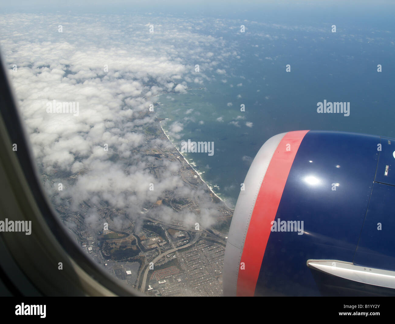 View outside window of an in flight passenger airplane making its ...