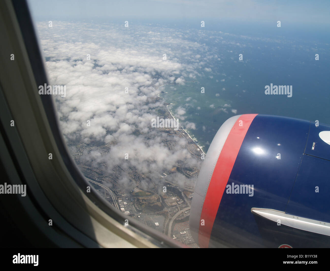 View outside window of an in flight passenger airplane making its ...