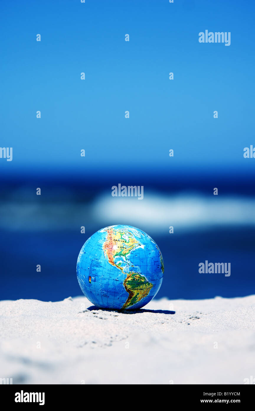 Earth globe on the beach. Ideal for Earth protection concepts ...