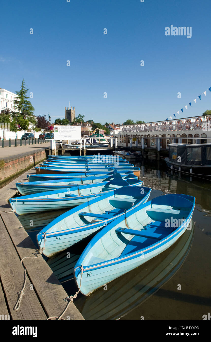 Blue painted wooden rowing boats on river Thames at Henley Stock Photo ...
