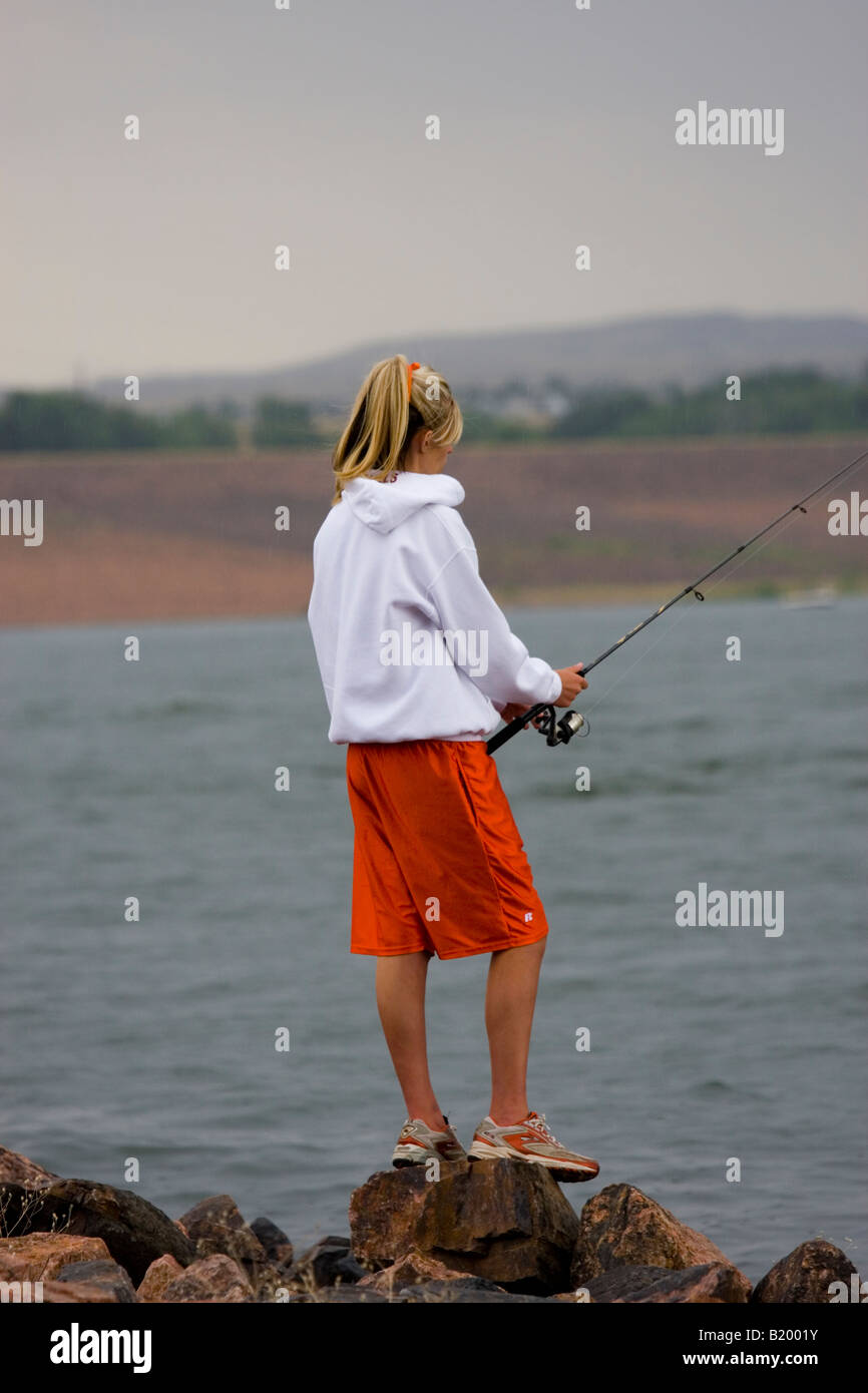 Blond girl fishing hi-res stock photography and images - Alamy
