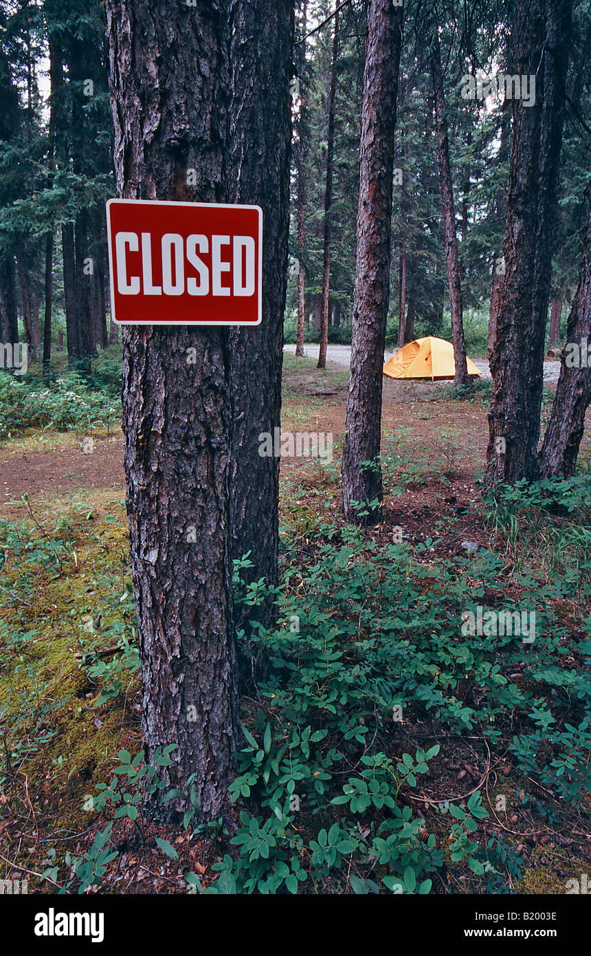 Tent in campground with closed sign on tree pointing to camp in Alberta ...