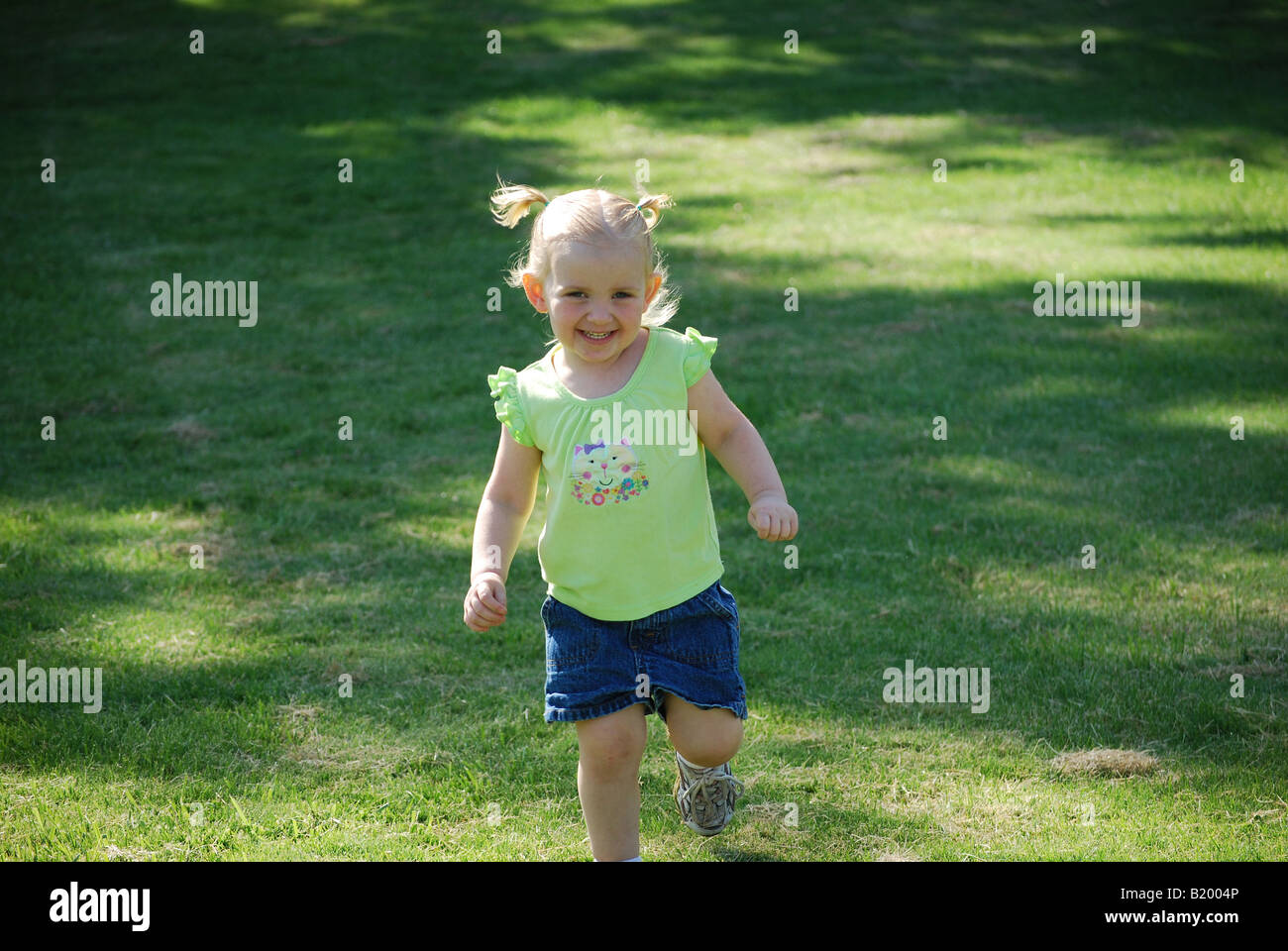 Young Blonde Girl Running Stock Photo - Alamy